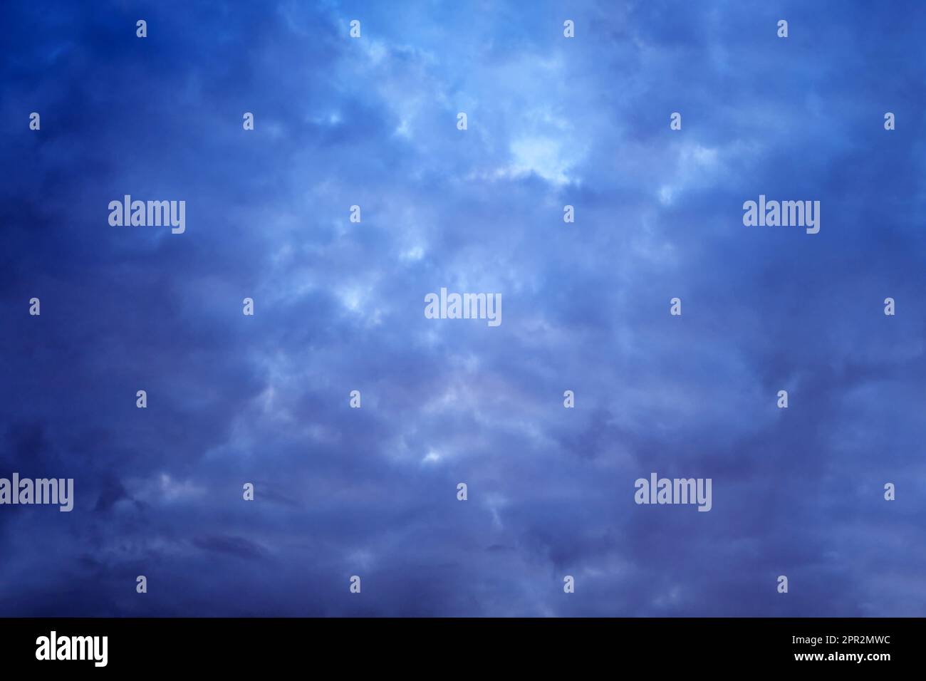Dark clouds in a dramatic sky. Storm clouds of deep blue color Stock ...