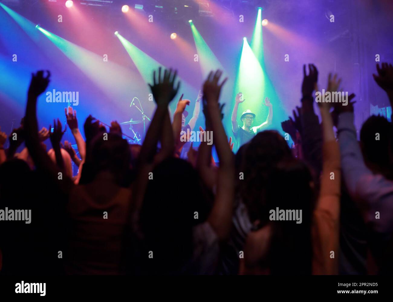 Fans, people or dancing at concert, music festival or night party, neon ...