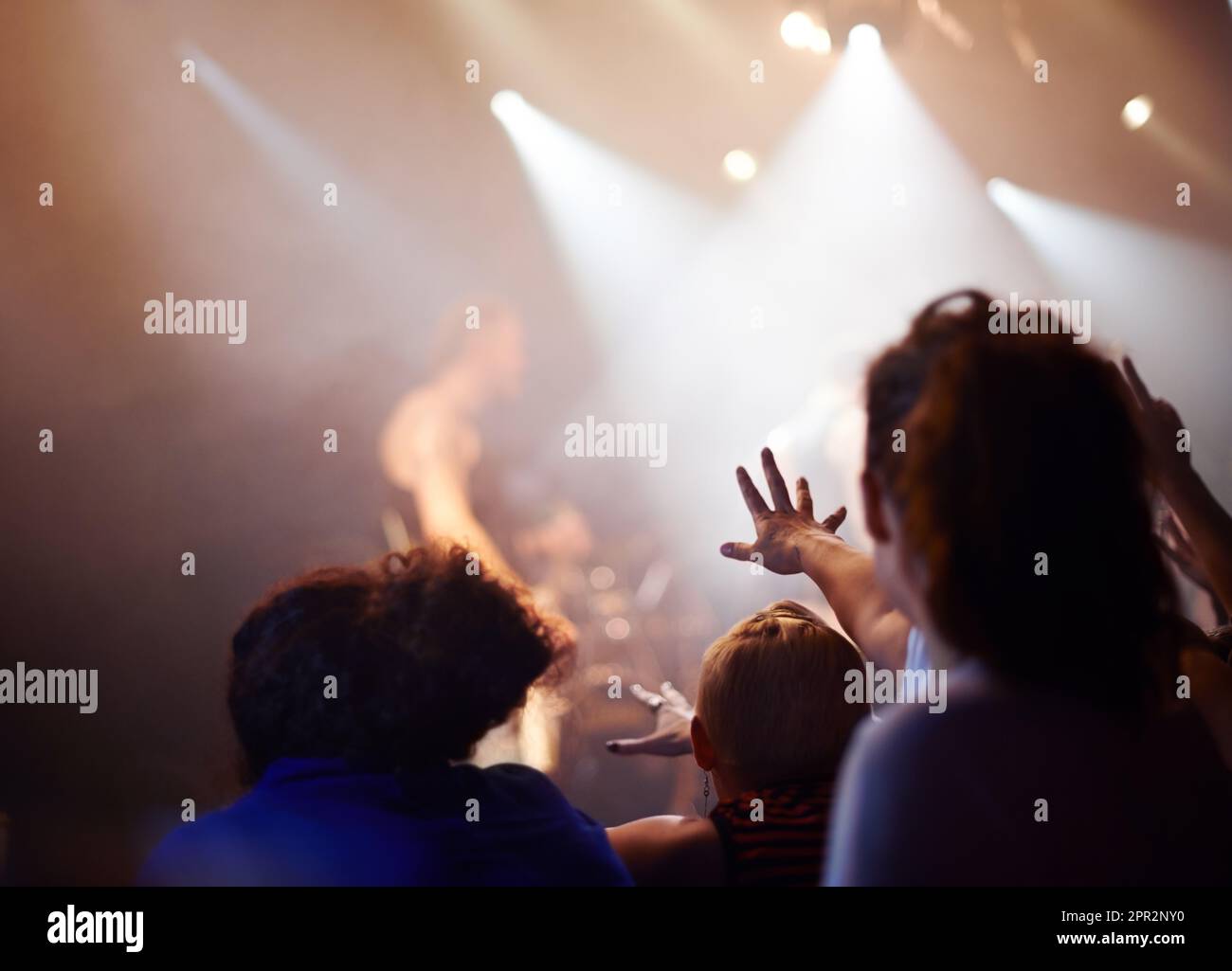 Hands, lighting and excited fans at music festival, crowd watching live ...