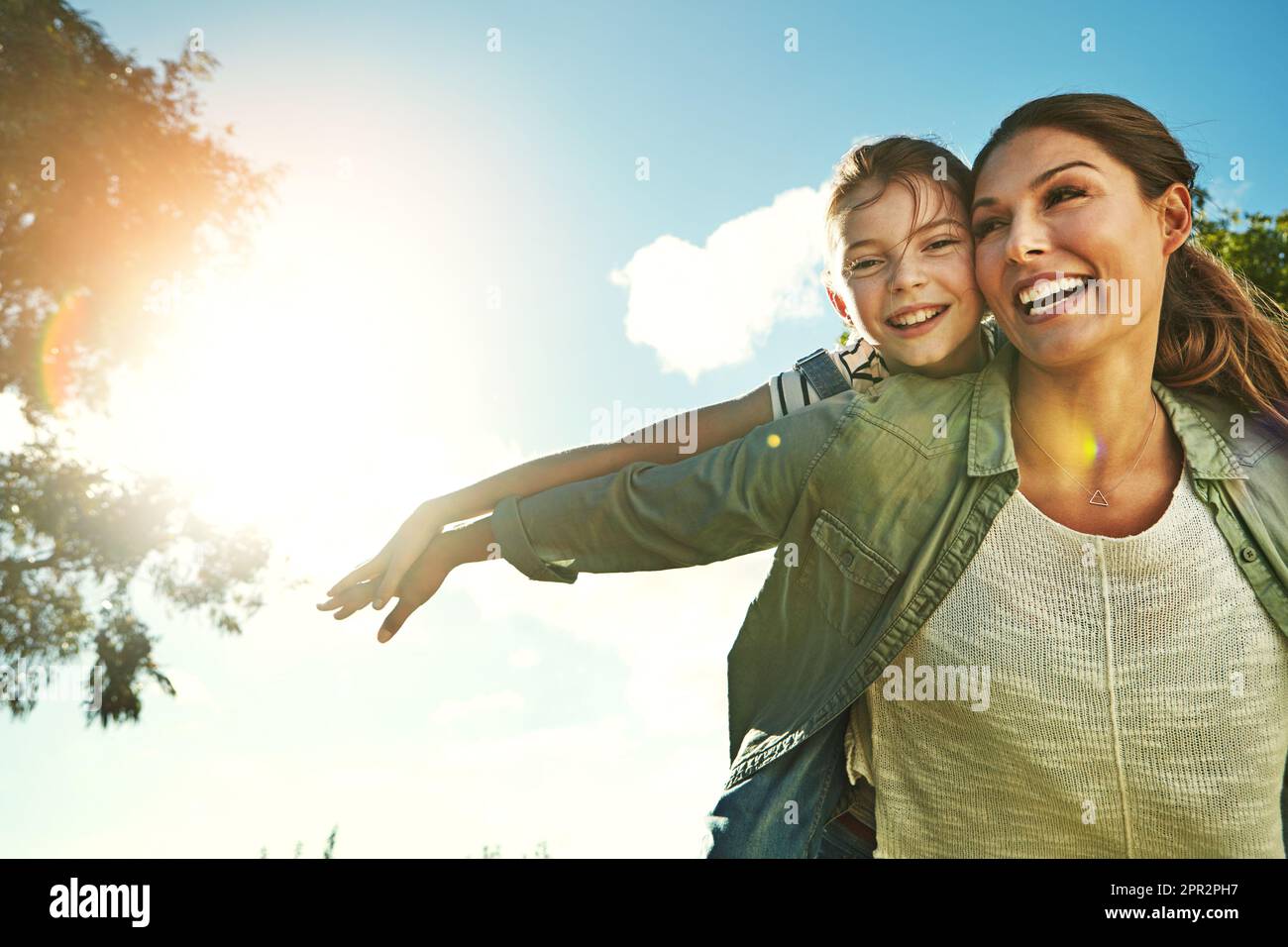 Basking in a day of summertime fun. a mother and her daughter bonding together outdoors Stock ...