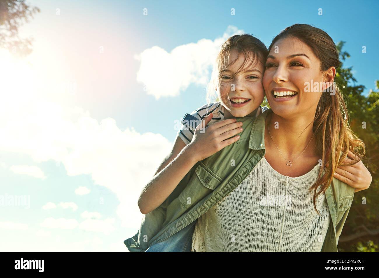 Giving her daughter a bright childhood to look back on. a mother and ...