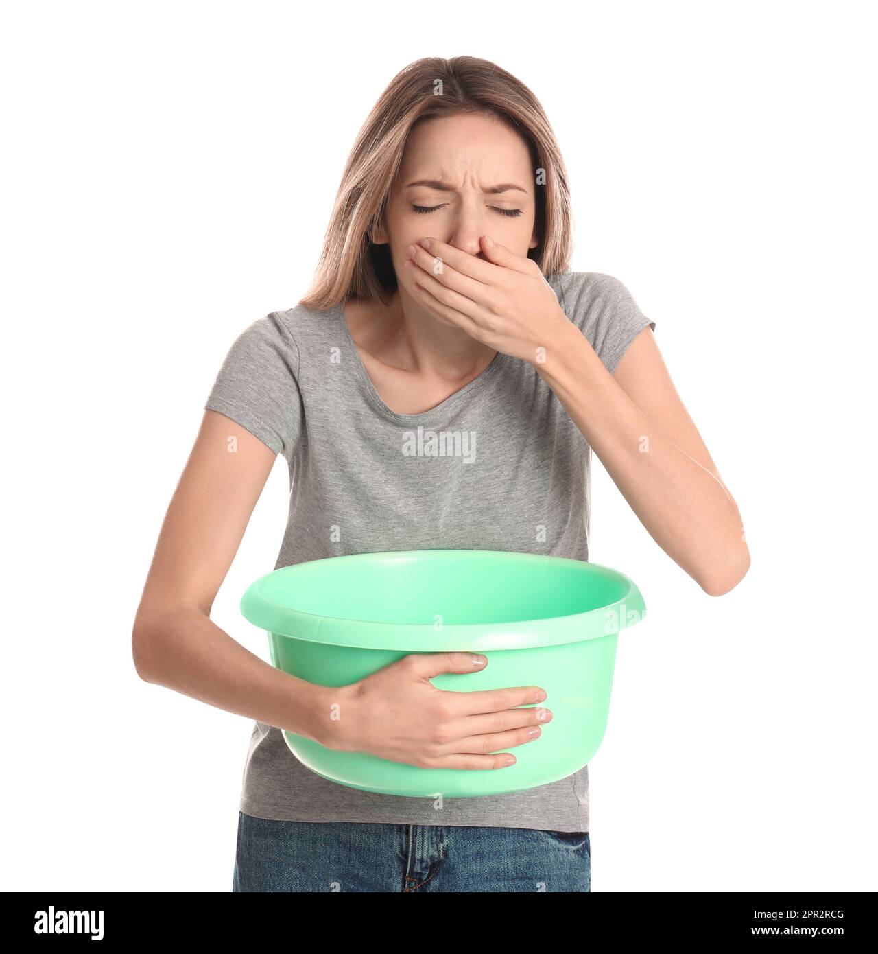 Woman with basin suffering from nausea on white background. Food ...