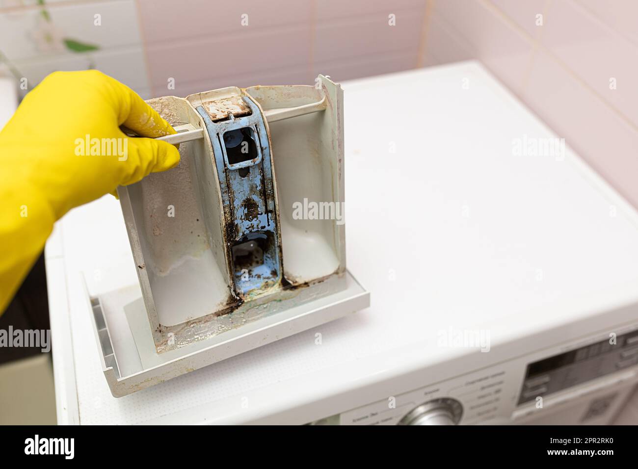 Human hand in yellow glove hold, check washing machine dispenser drawer ...