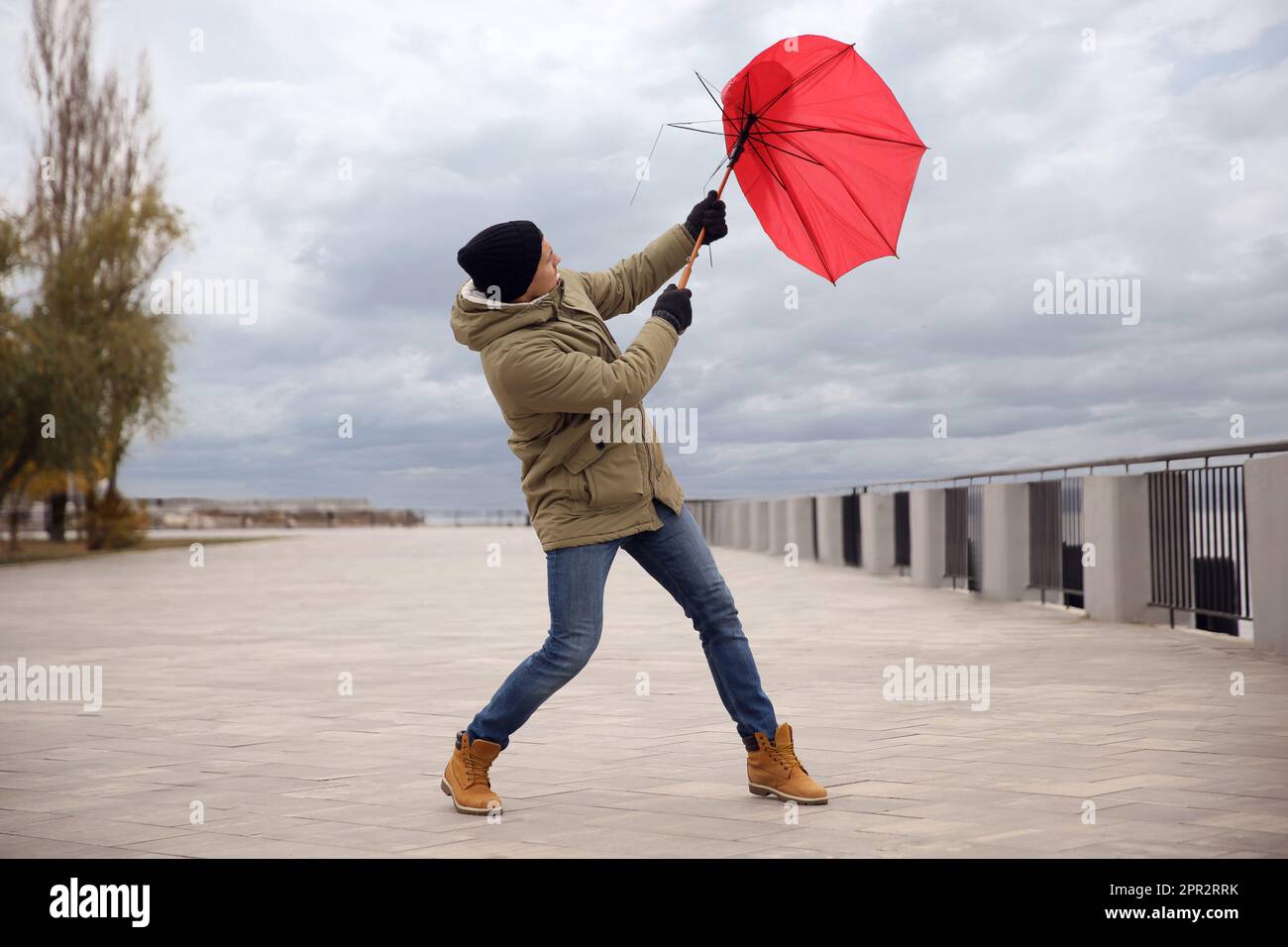 Strong wind umbrella man hi-res stock photography and images - Alamy