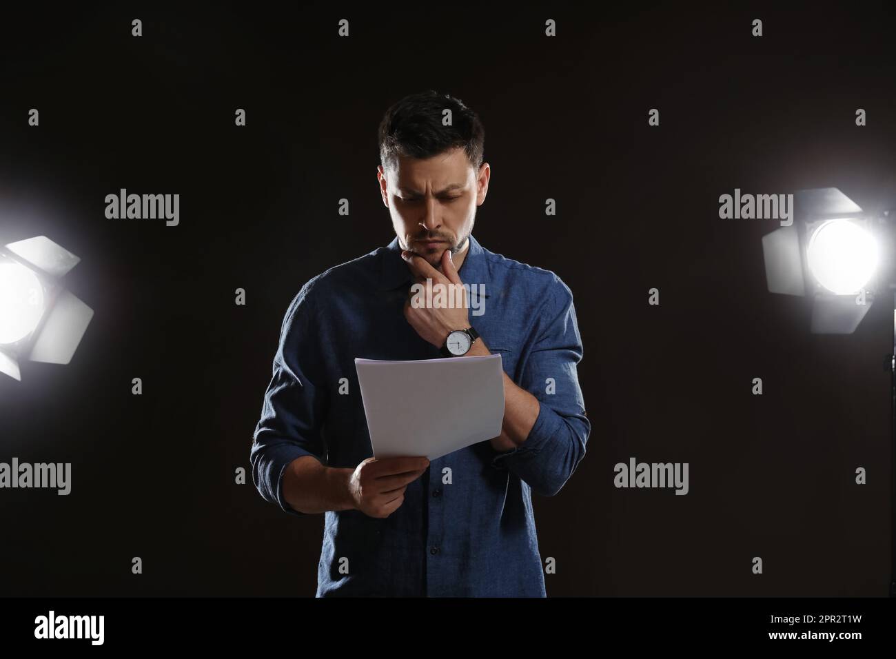 Professional actor reading his script during rehearsal in theatre Stock ...