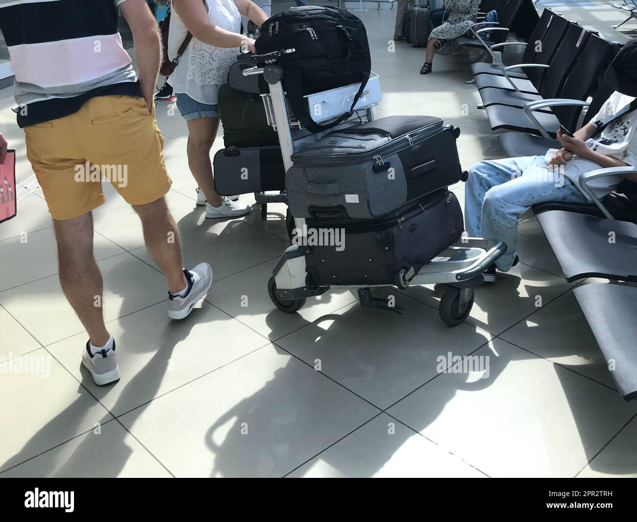 Group of people standing in queue at boarding gate Stock Photo - Alamy