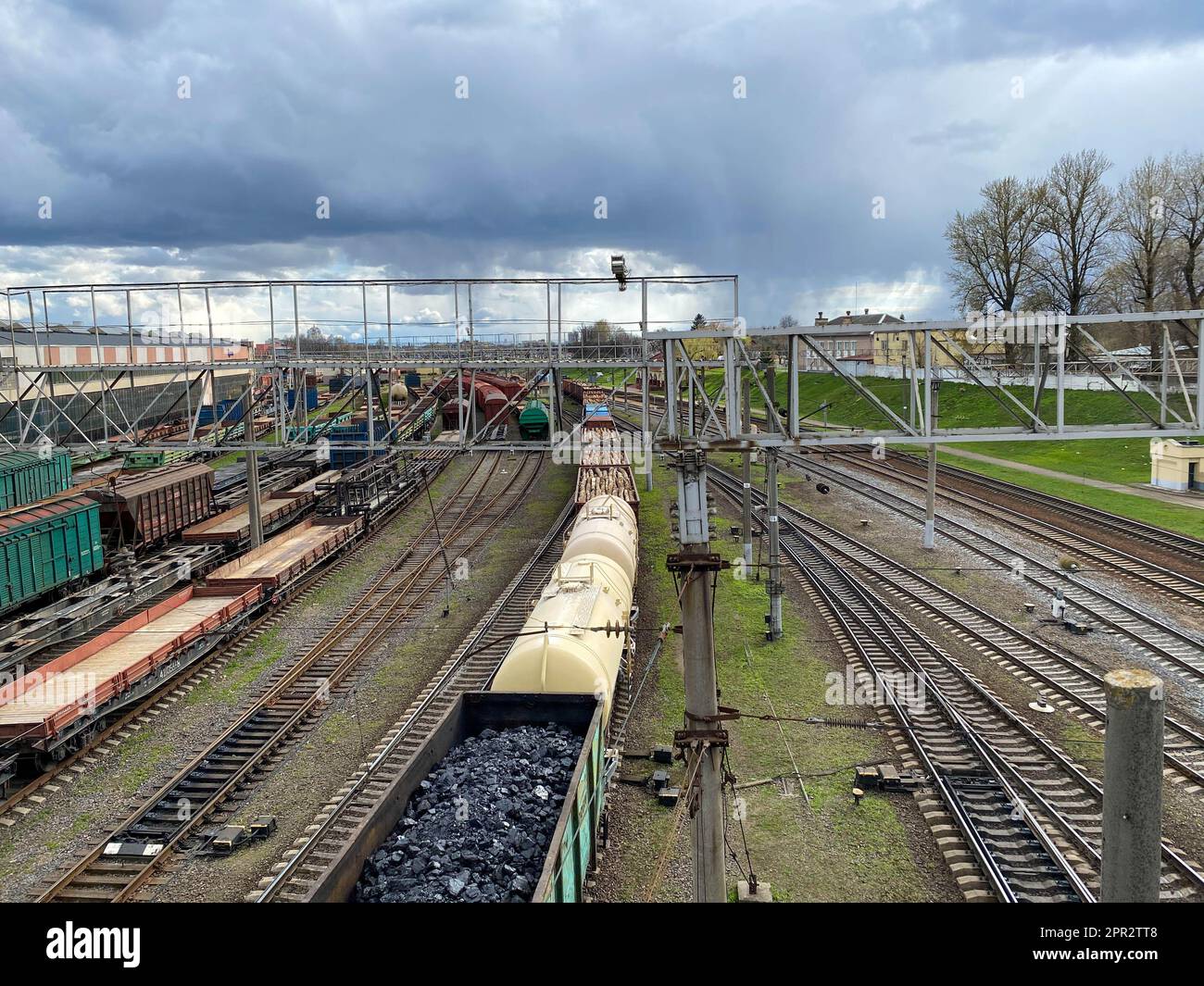 Aerial view of colorful freight trains on railway station. Wagons with ...