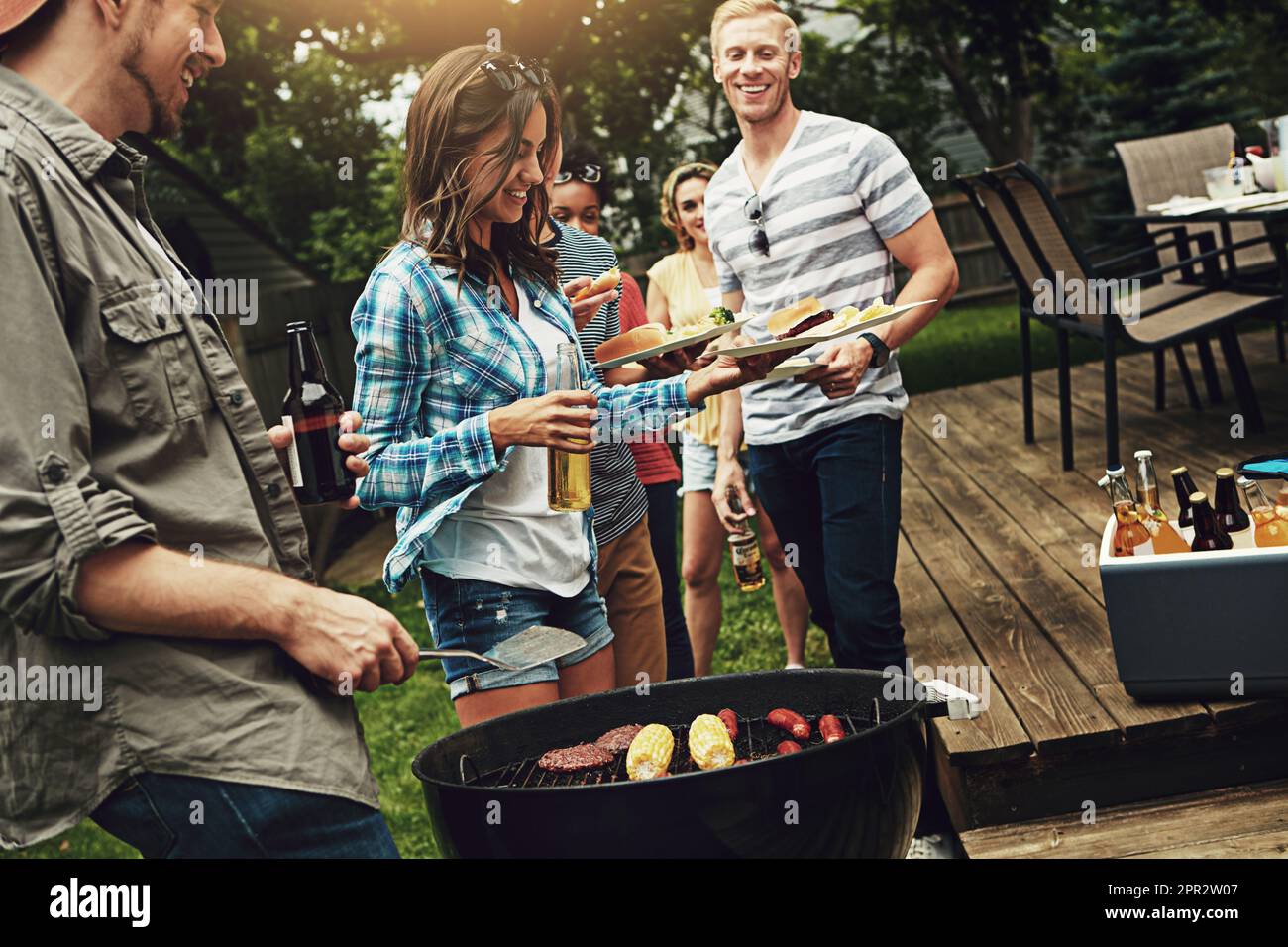 Barbecue time is bonding time. a group of friends having a barbecue in ...