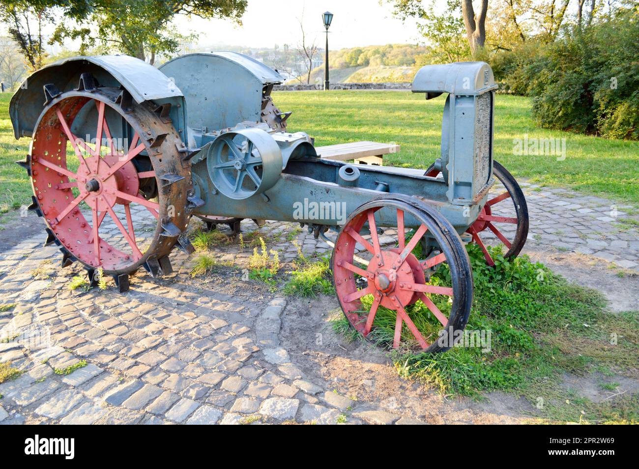 very old retro tractor with metal wheels Stock Photo - Alamy
