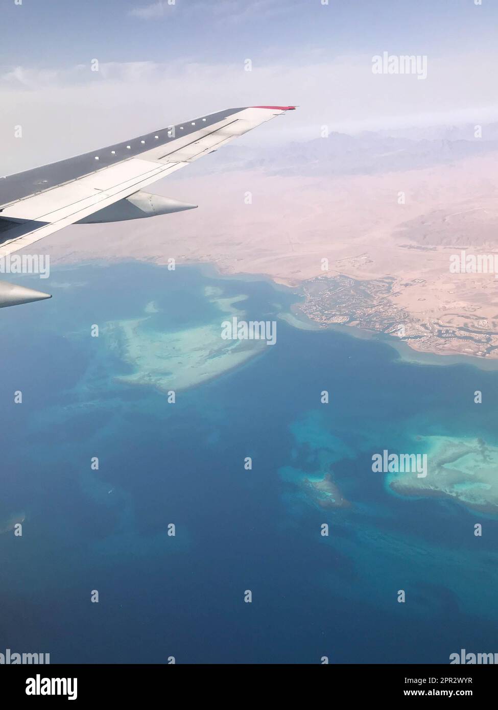 The top view of the earth from the porthole, the airplane window on the ...