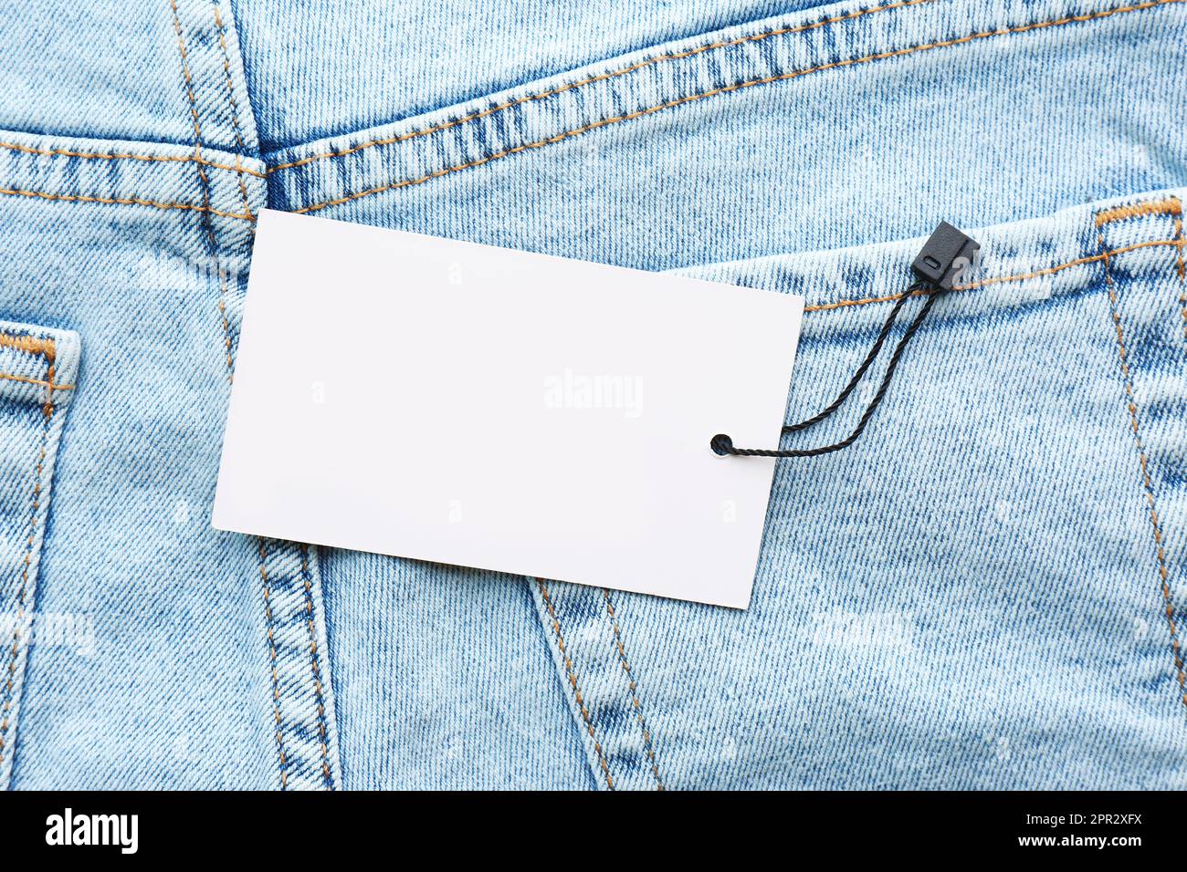 Blank tag on jeans, top view. Space for text Stock Photo - Alamy