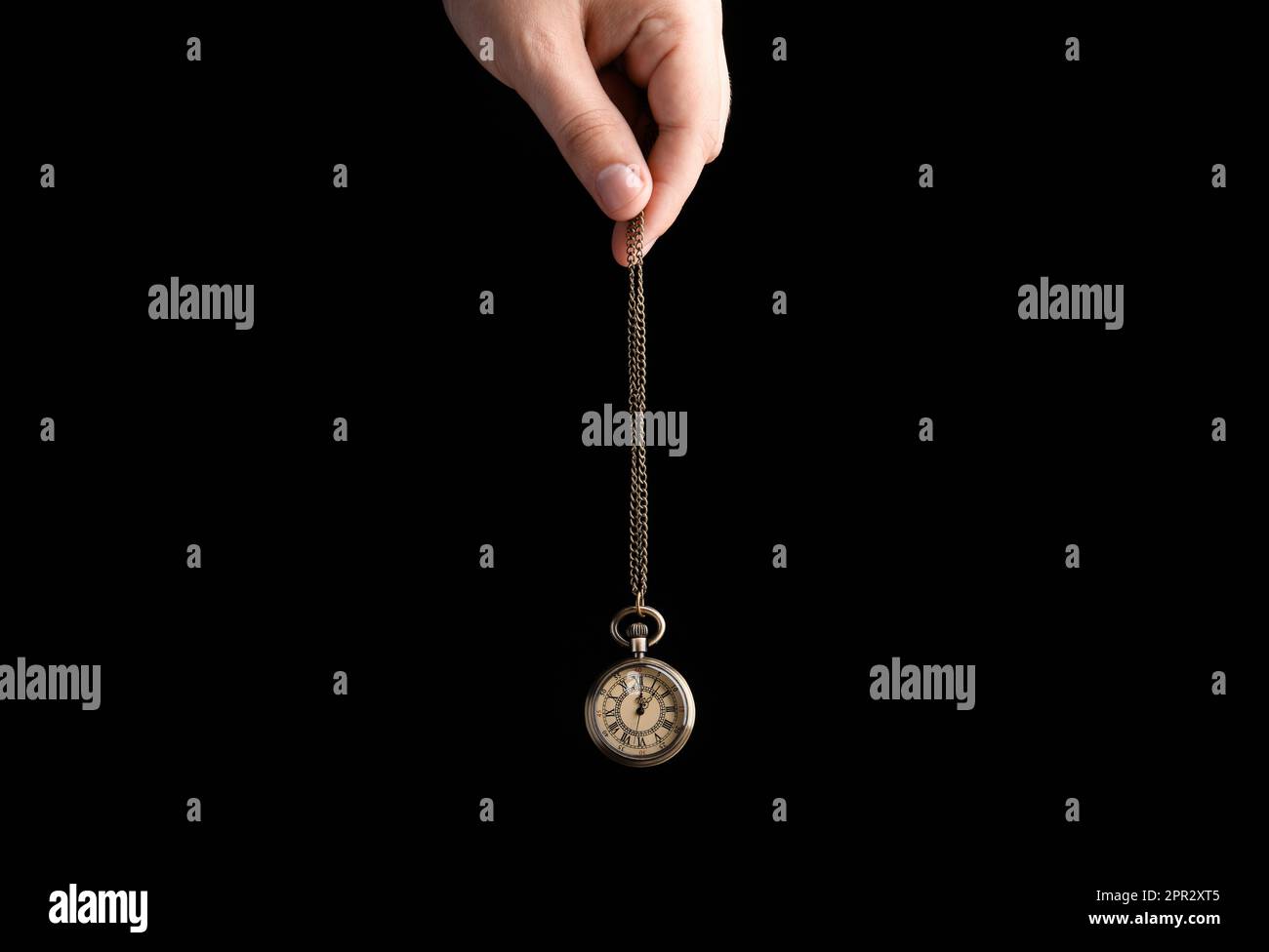 Psychotherapist with pendulum on black background, closeup ...