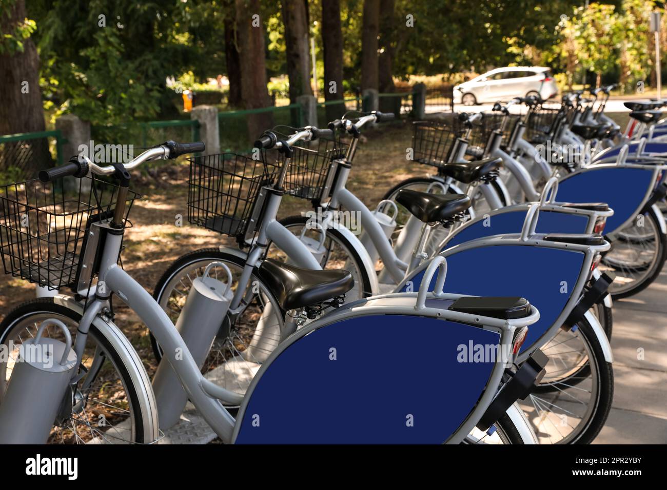 Parking rack with many bicycles outdoors. Bike rental Stock Photo - Alamy