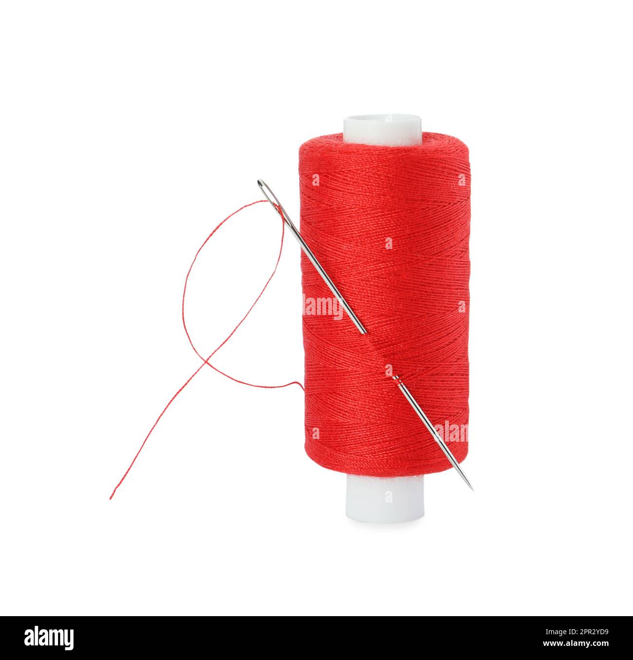 Spool of red sewing thread with needle isolated on white Stock Photo ...