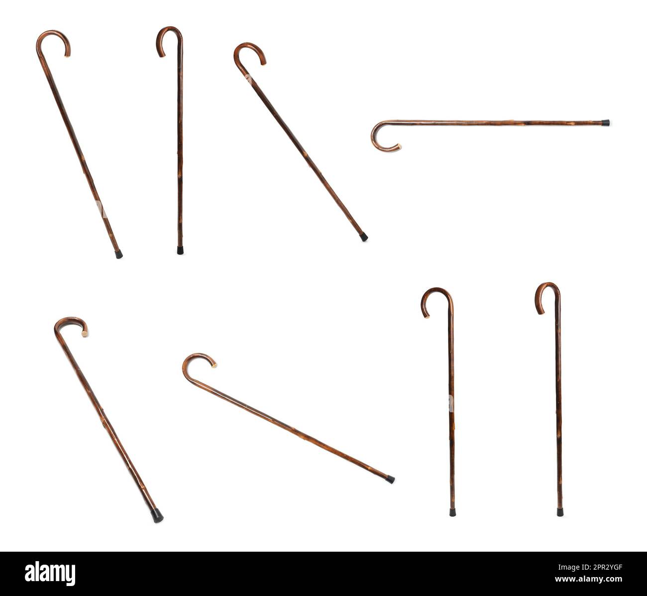 Set with elegant wooden walking canes on white background Stock Photo ...