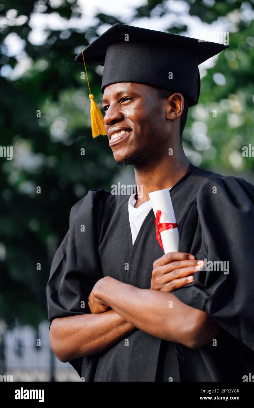 Male college graduate posing outdoors hi-res stock photography and ...