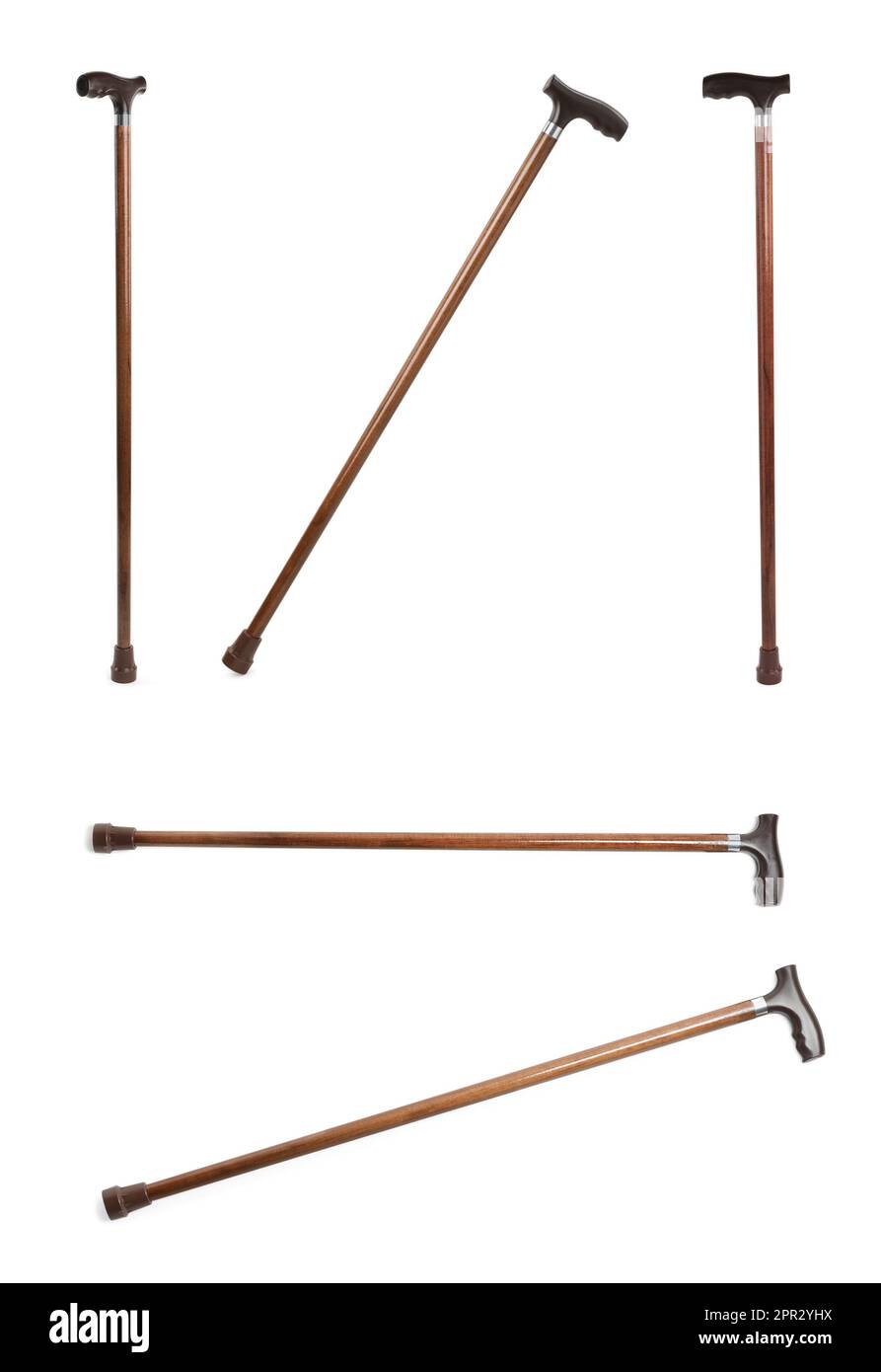 Set with elegant wooden walking canes on white background Stock Photo ...