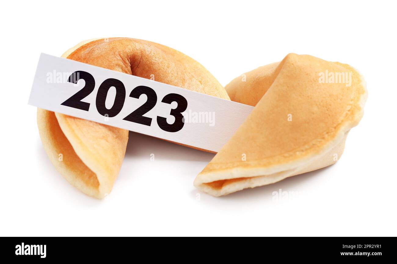 Tasty fortune cookies and paper with number 2023 on white background ...
