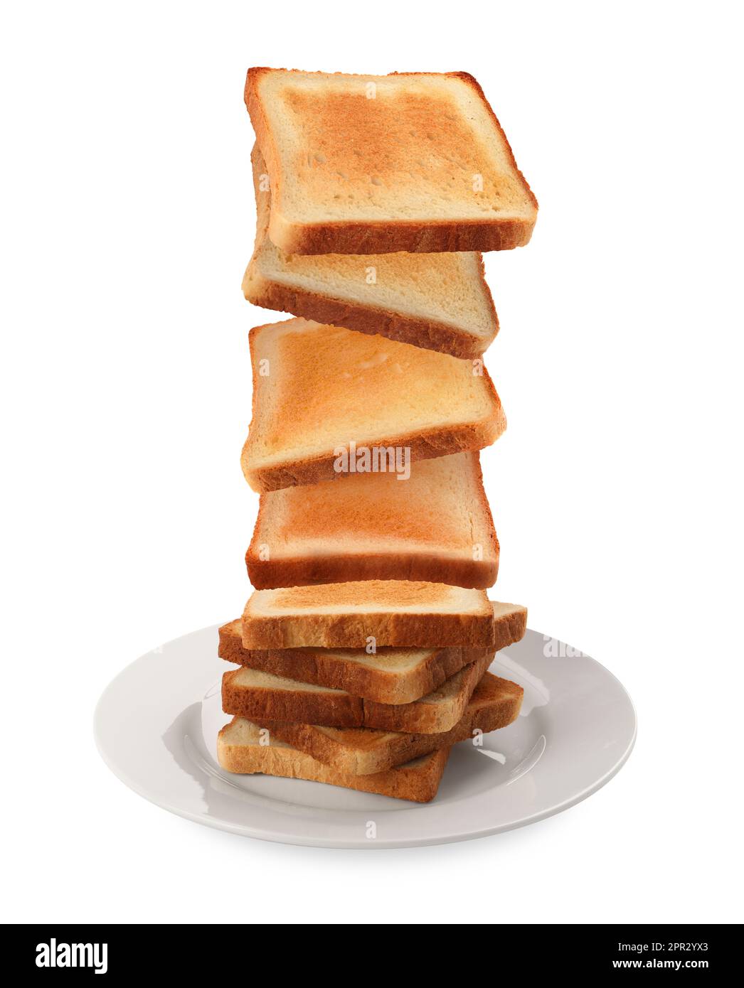 Delicious toasted bread falling into plate on white background Stock ...