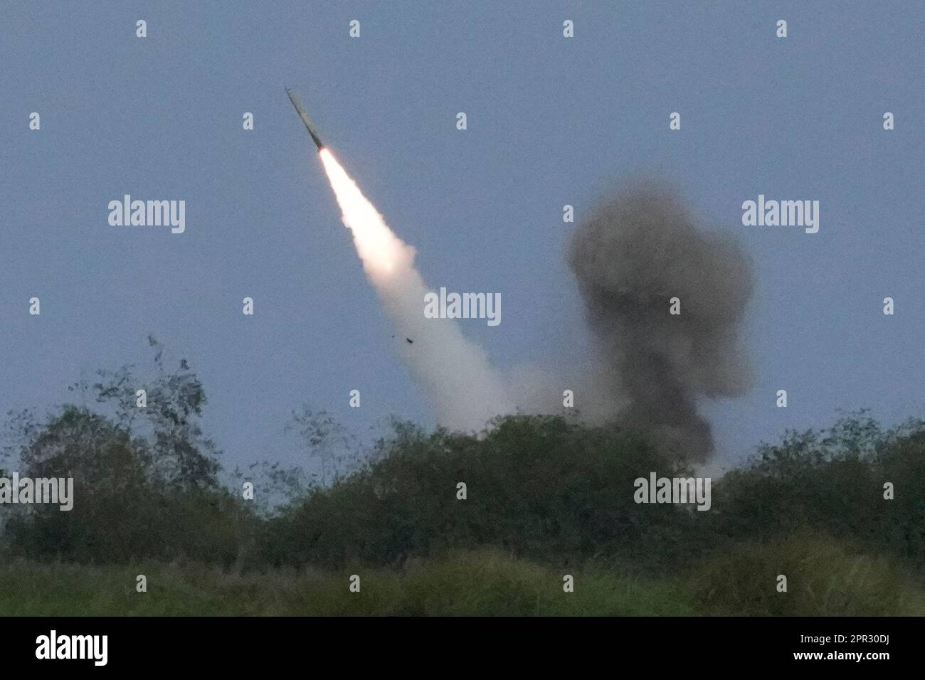 A U.S. M142 High Mobility Artillery Rocket System (HIMARS) fires a ...