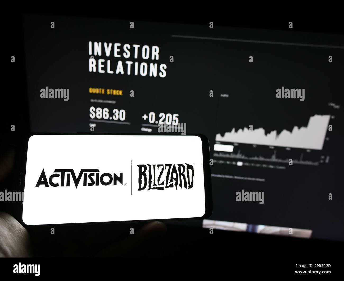 Person holding mobile phone with logo of US video game company ...