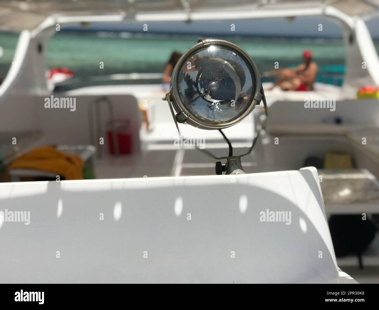 A large lamp, a spotlight, a searchlight on a boat, a ship against the ...