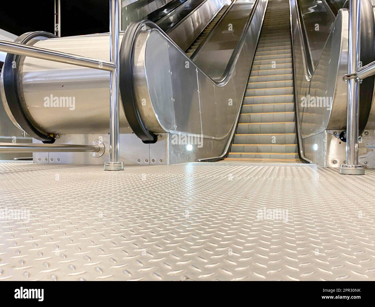 escalator in the underpass. rise to different metro stations. huge ...