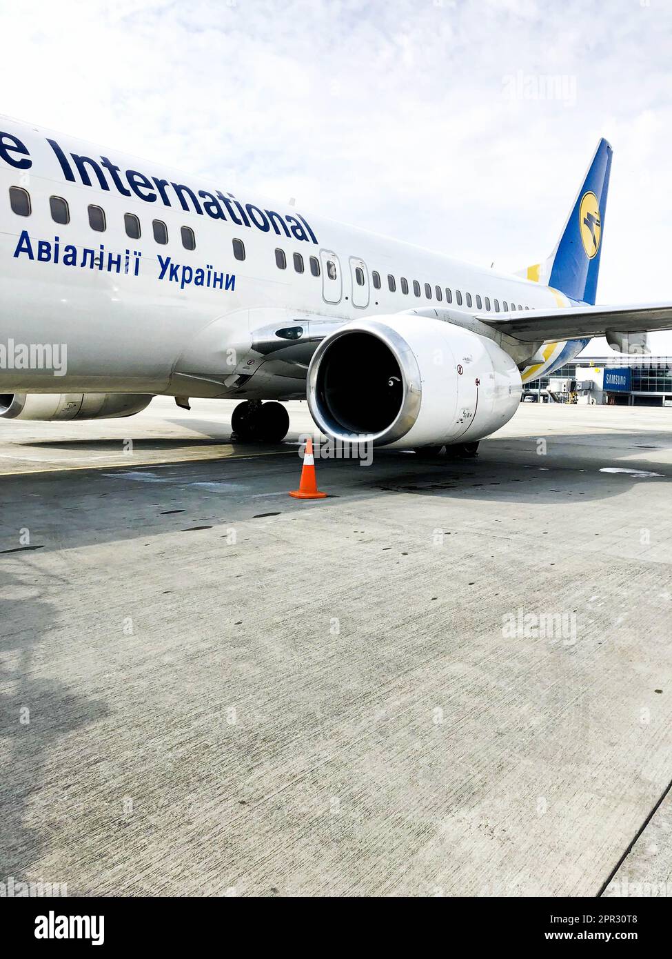 Beautiful fast white jet plane of Ukraine airlines with engine and ...