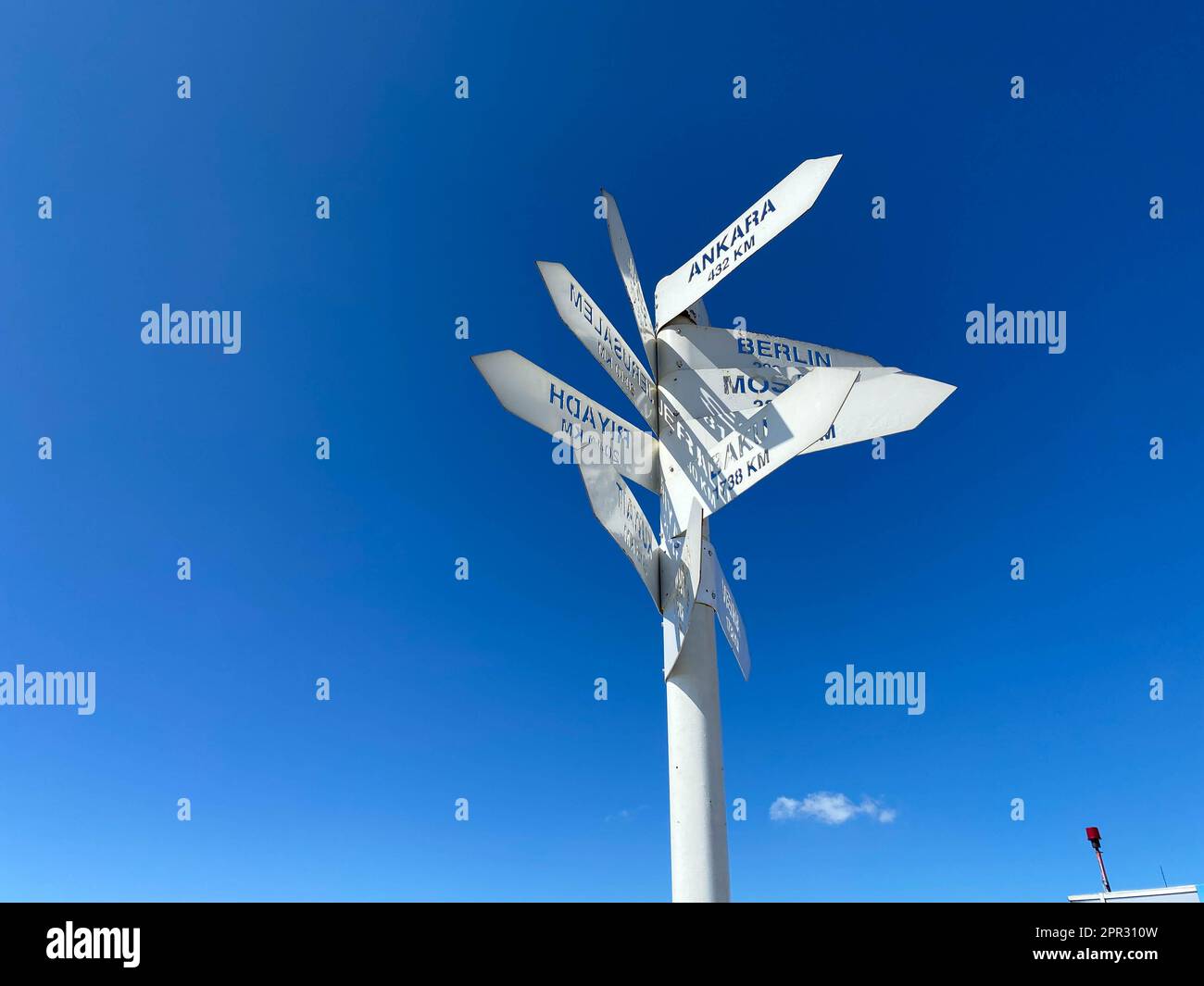 Tourism and travel concept. Colorful wooden road sign pointing ...