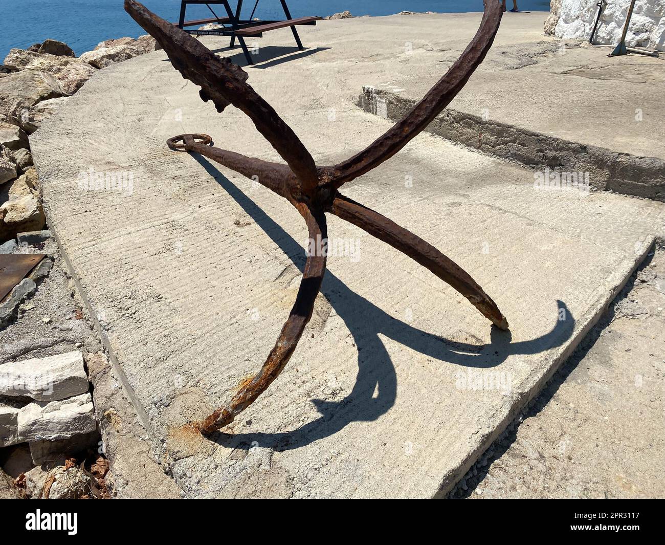 Nautical symbol. Big rusty old anchor out of the water Stock Photo - Alamy