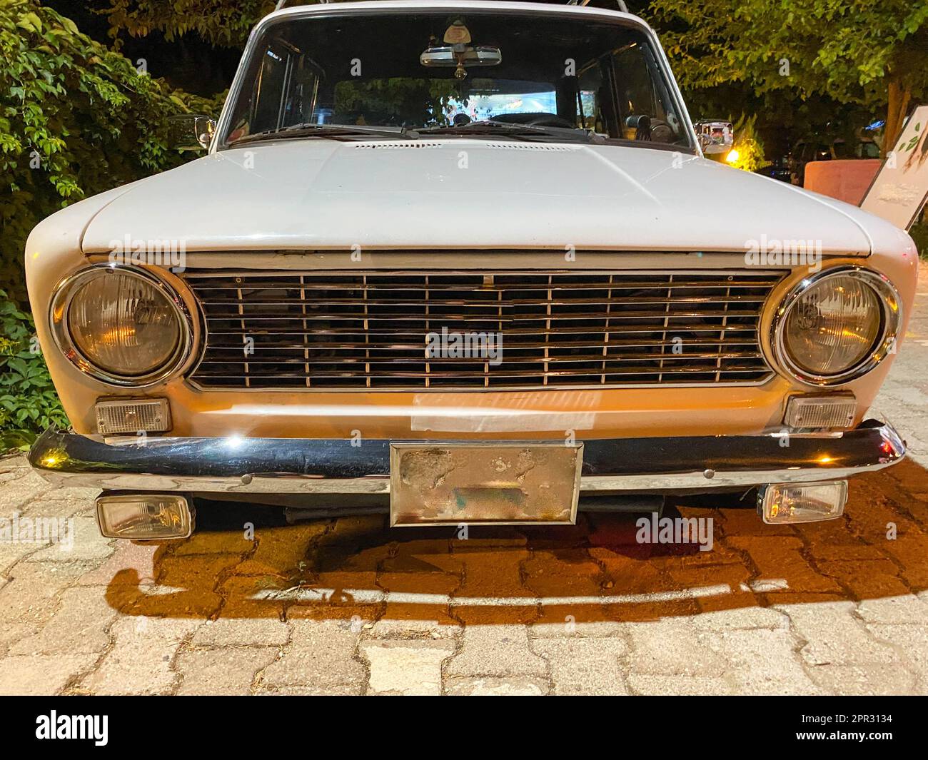 Old white retro restored classic car from 60s, 70s, 80s, 90s with round ...