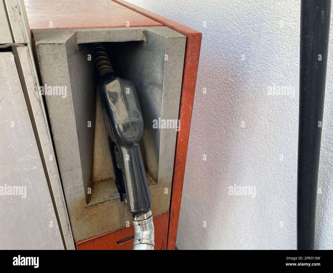 refueling gun in the fuel dispenser socket Stock Photo - Alamy