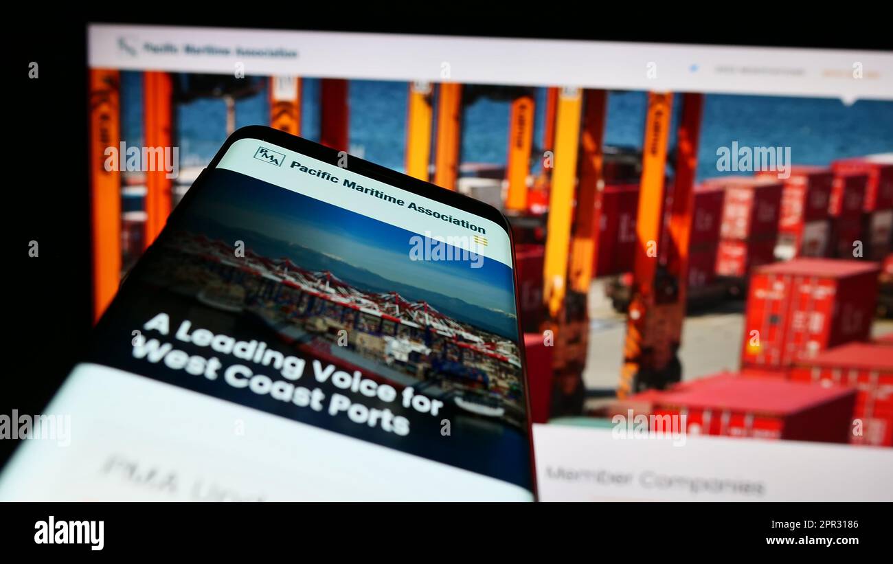 Mobile phone with web page and logo of organization Pacific Maritime ...