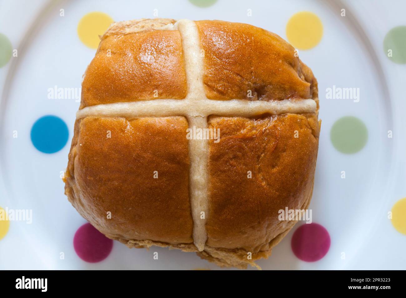 Banoffee hot cross bun, banana & Caramel fudge from M&S on spotty plate ...