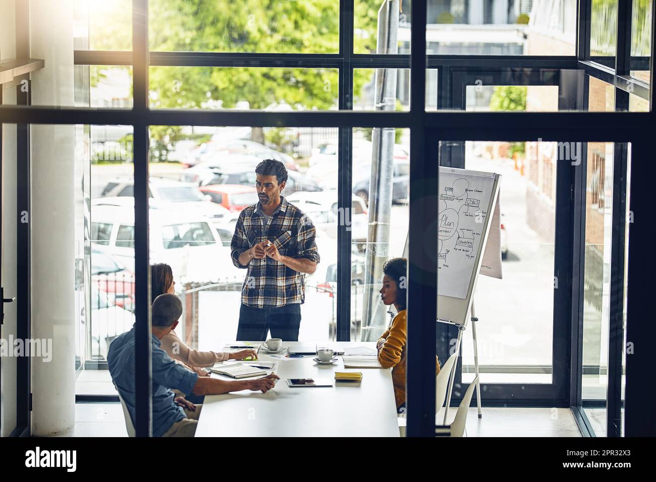 Lets discuss a few things...a businessman giving a presentation to ...