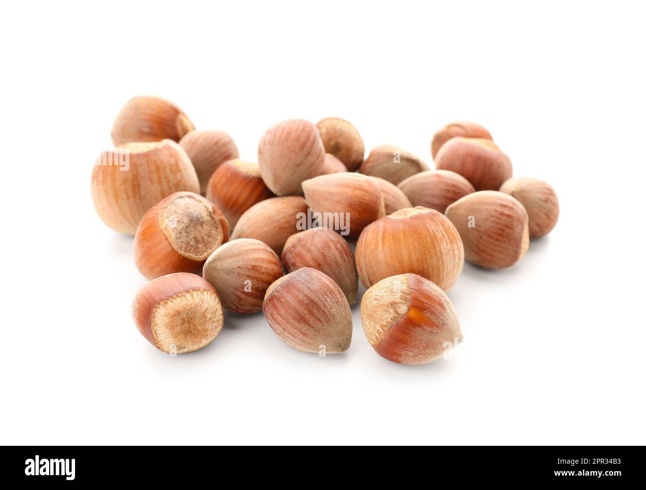 Shelled hazelnuts on white background Stock Photo - Alamy