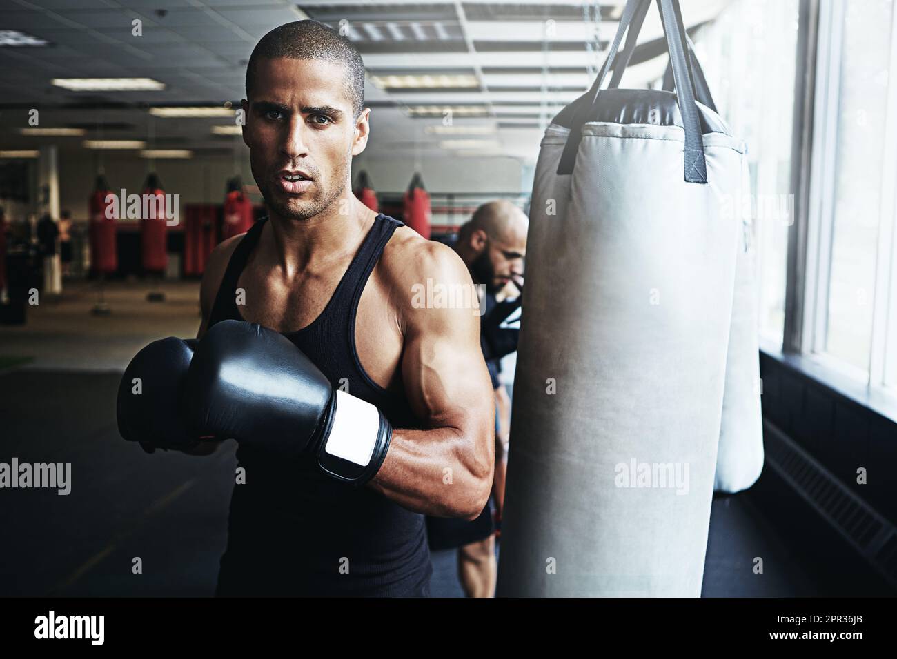 You are stronger than yesterday. a male boxer training at the gym Stock ...
