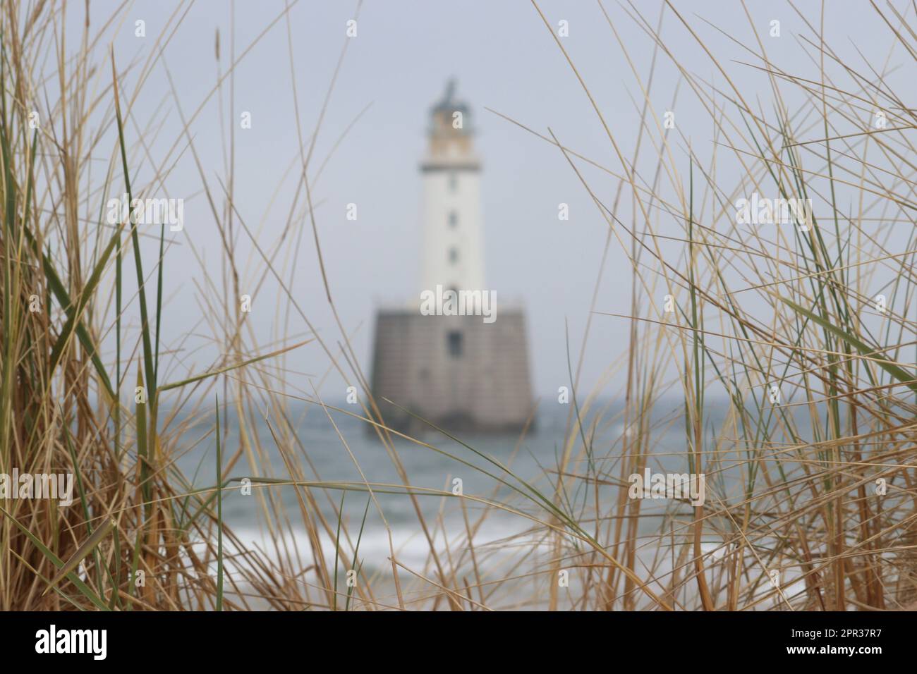 White lighthouse in mist Stock Photo - Alamy