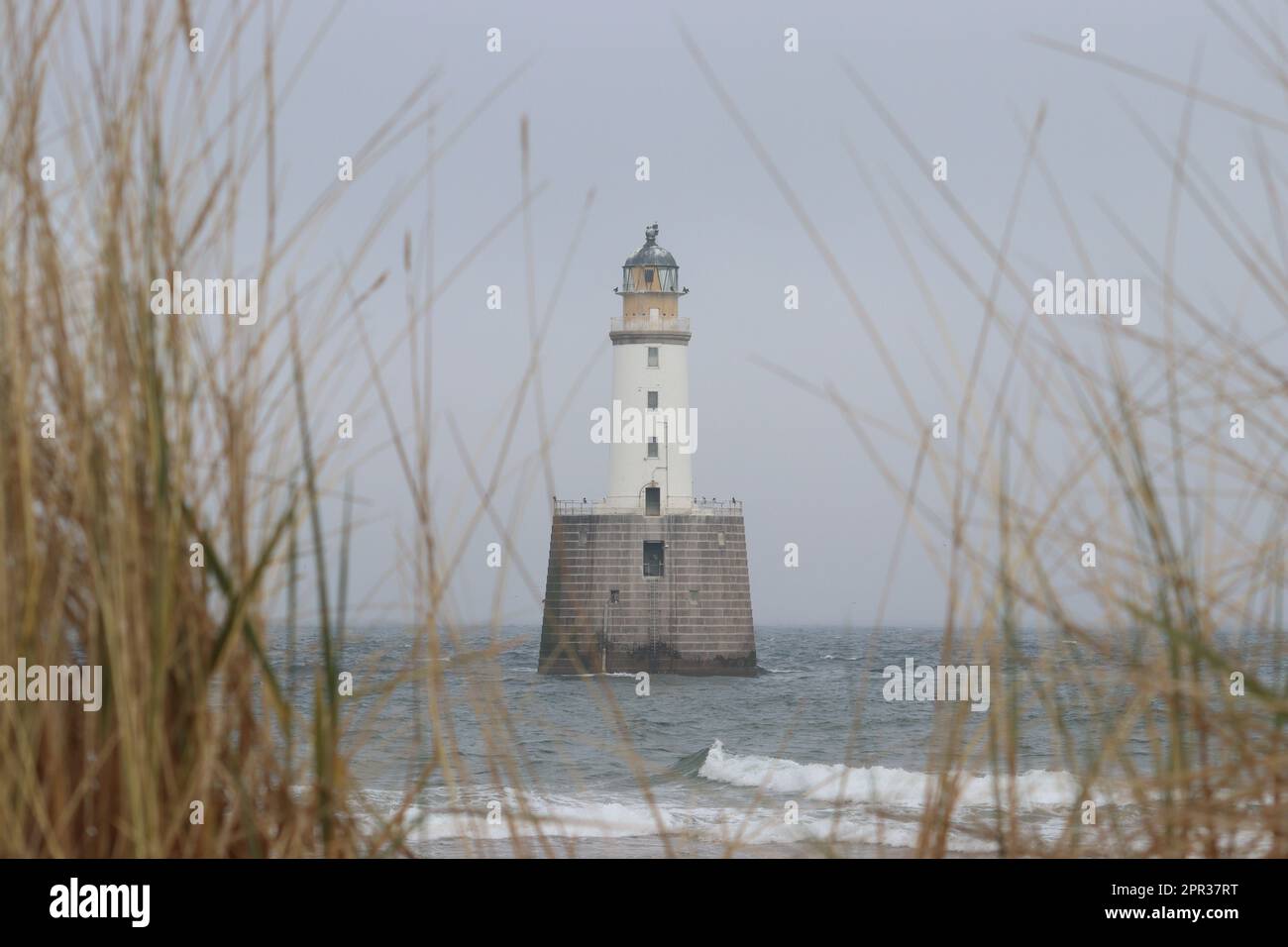 White lighthouse in mist Stock Photo - Alamy