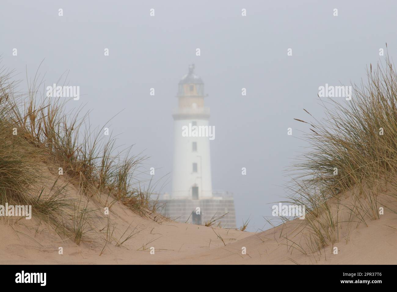 White lighthouse in mist Stock Photo - Alamy