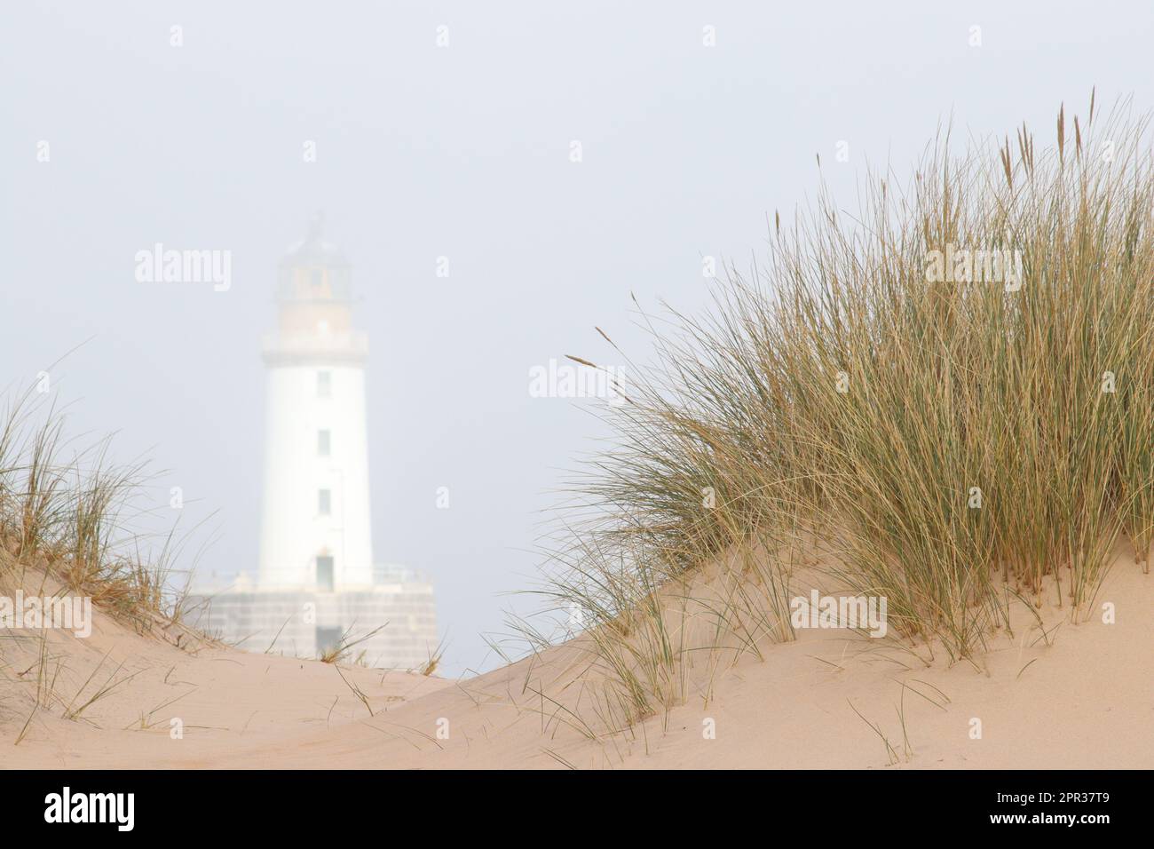 White lighthouse in mist Stock Photo - Alamy