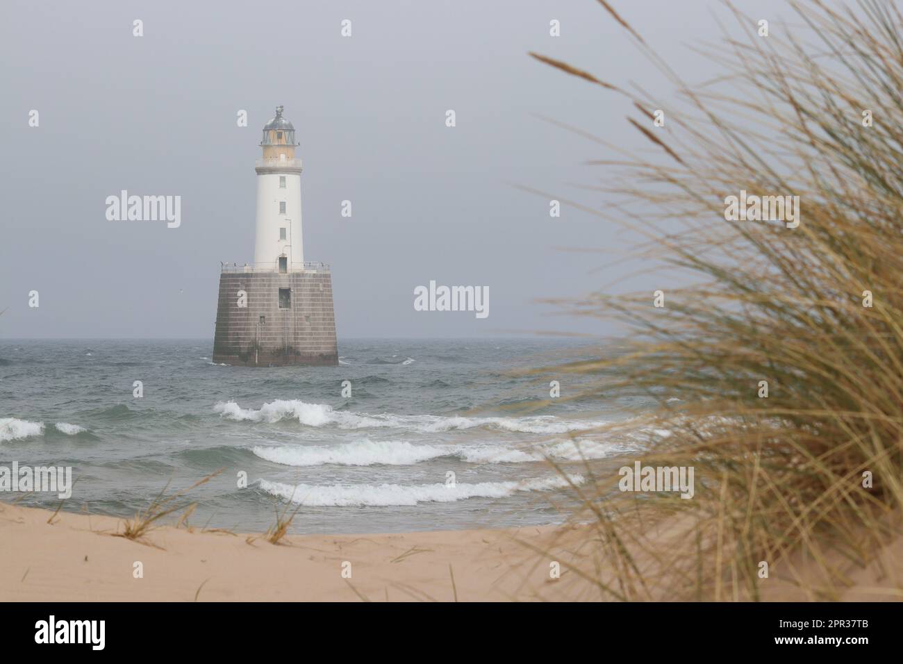 White lighthouse in mist Stock Photo - Alamy