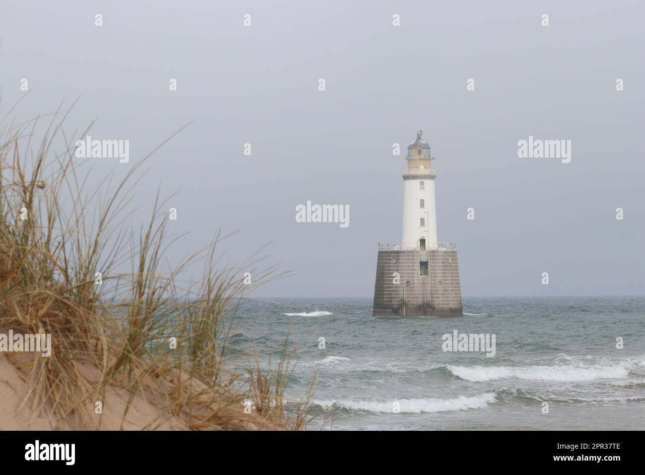 White lighthouse in mist Stock Photo - Alamy