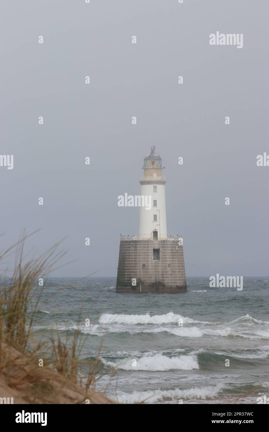 White lighthouse in mist Stock Photo - Alamy