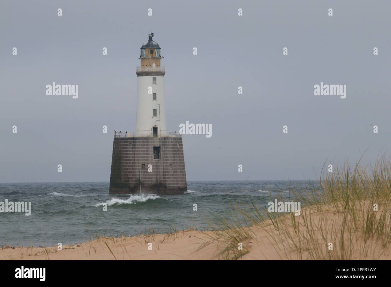White lighthouse in mist Stock Photo - Alamy