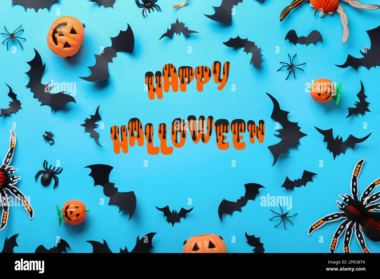 Frame made with Halloween decor elements on light blue background, flat ...