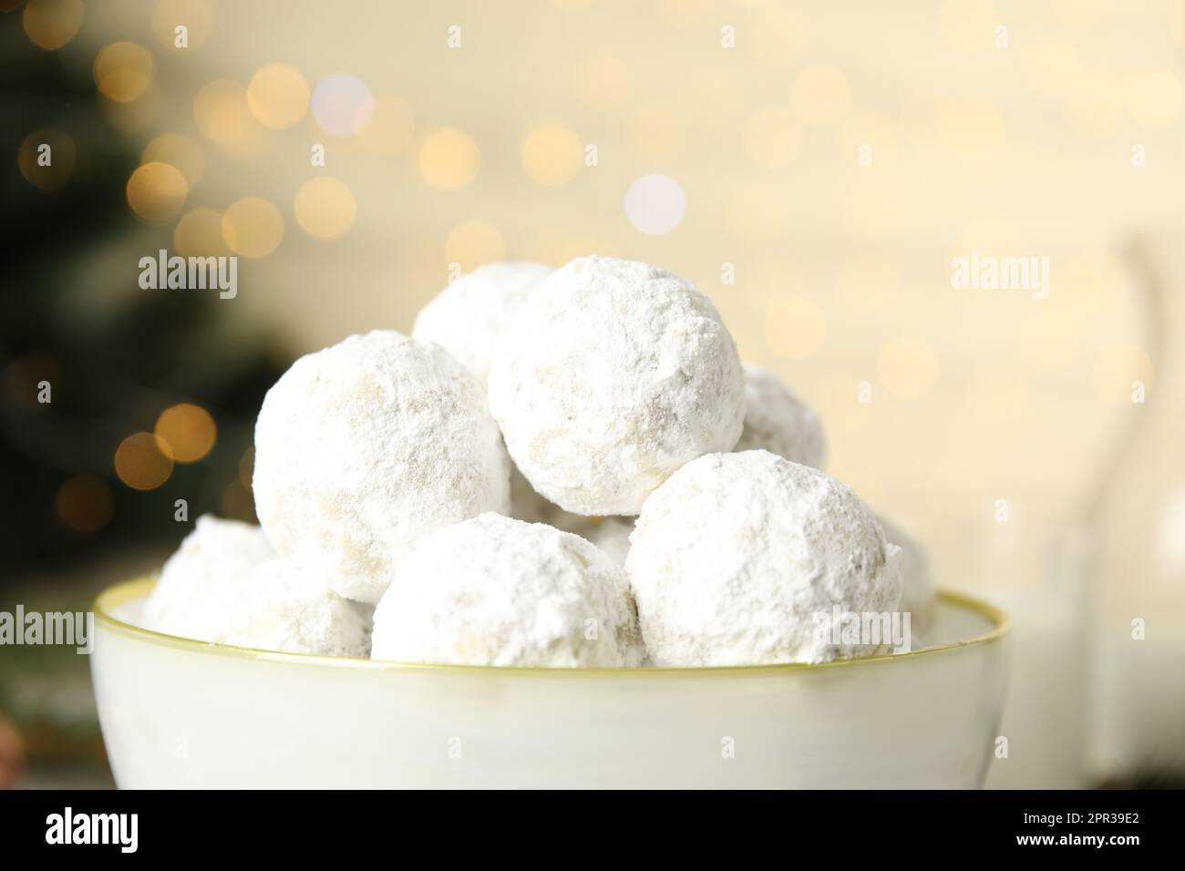 Tasty snowball cookies in light bowl, closeup, Christmas treat Stock ...