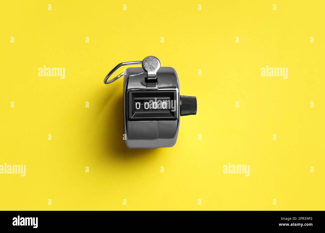 Modern timer on yellow background, top view Stock Photo - Alamy