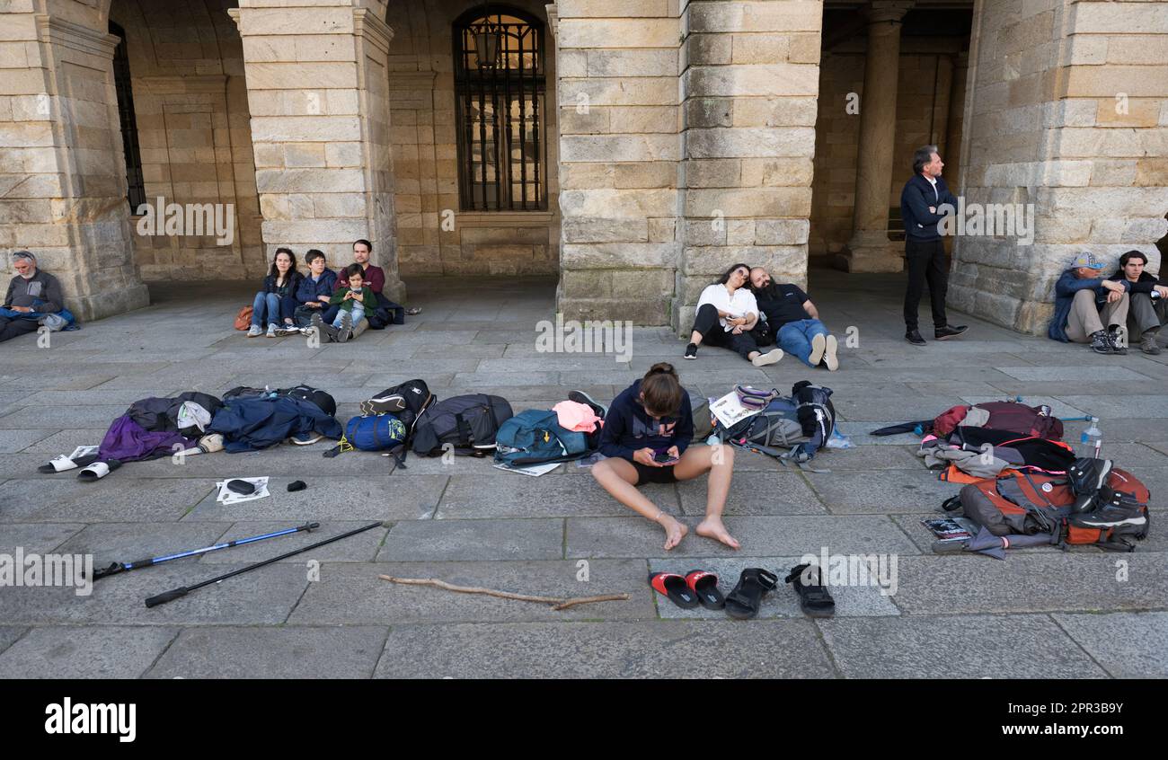 Pilgrims or walkers arrive after walking their Camino de Santiago in ...
