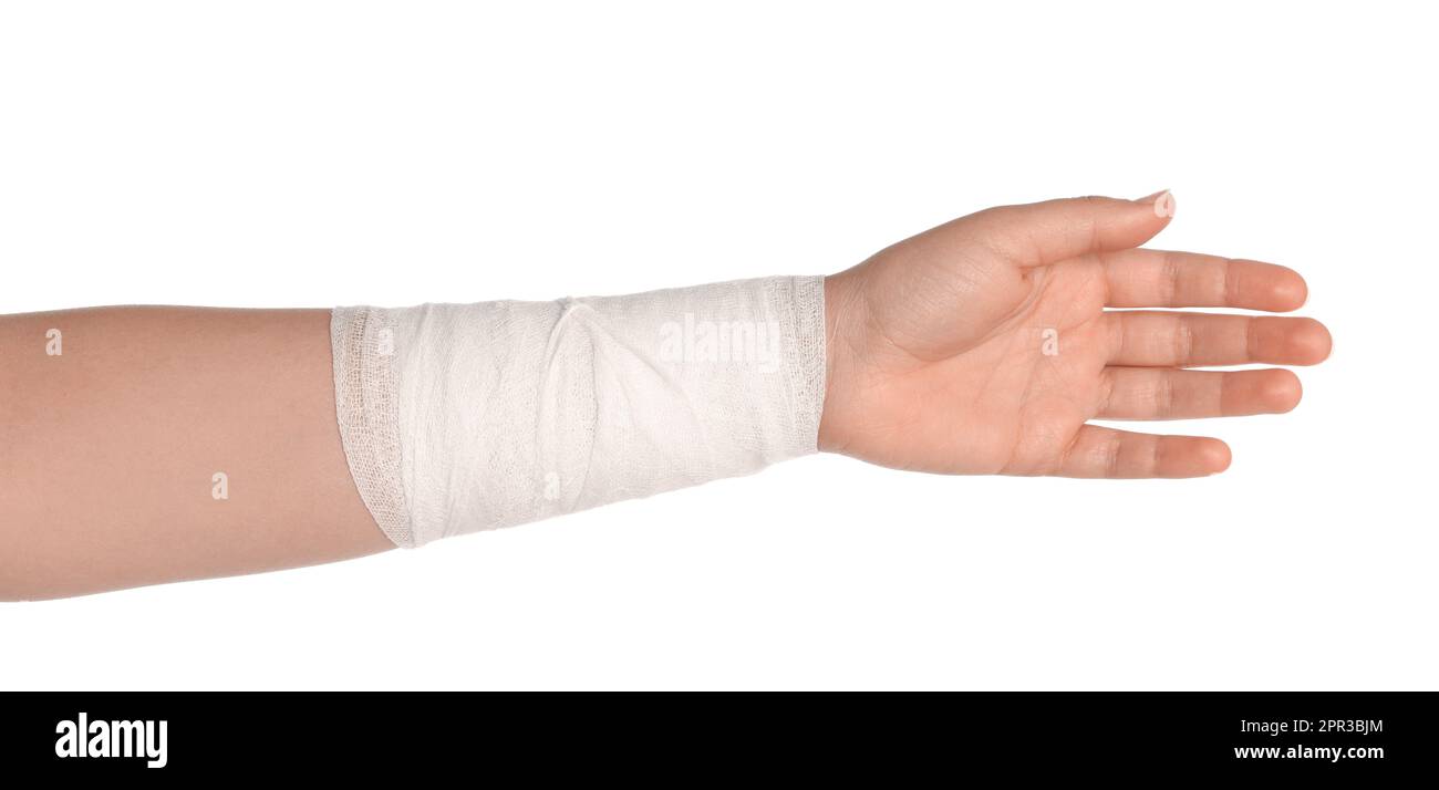 Woman with wrist wrapped in medical bandage on white background ...